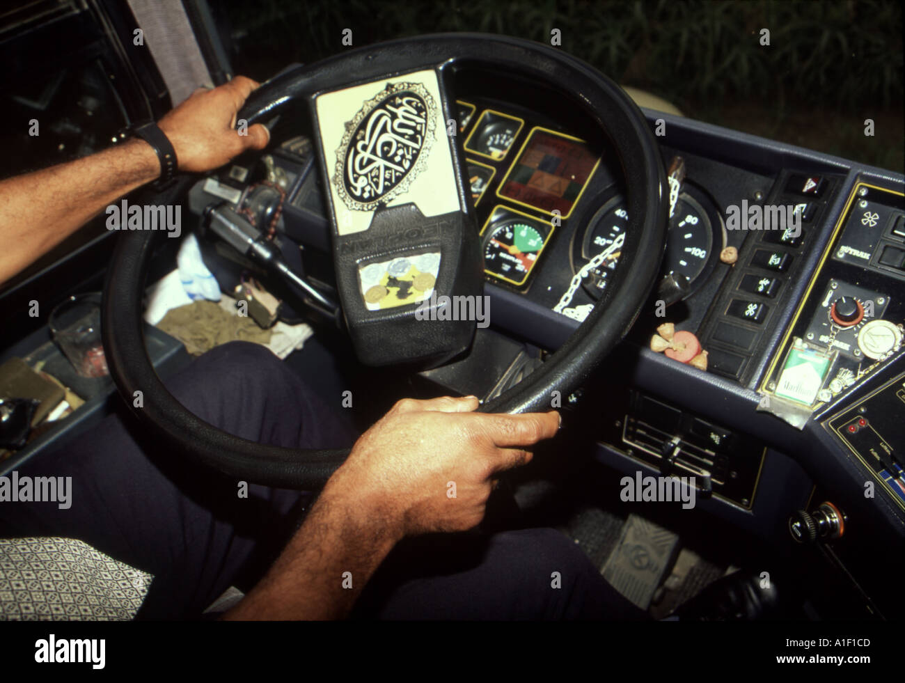 Bus driver with a sticker of the bismillah on his steering wheel ...