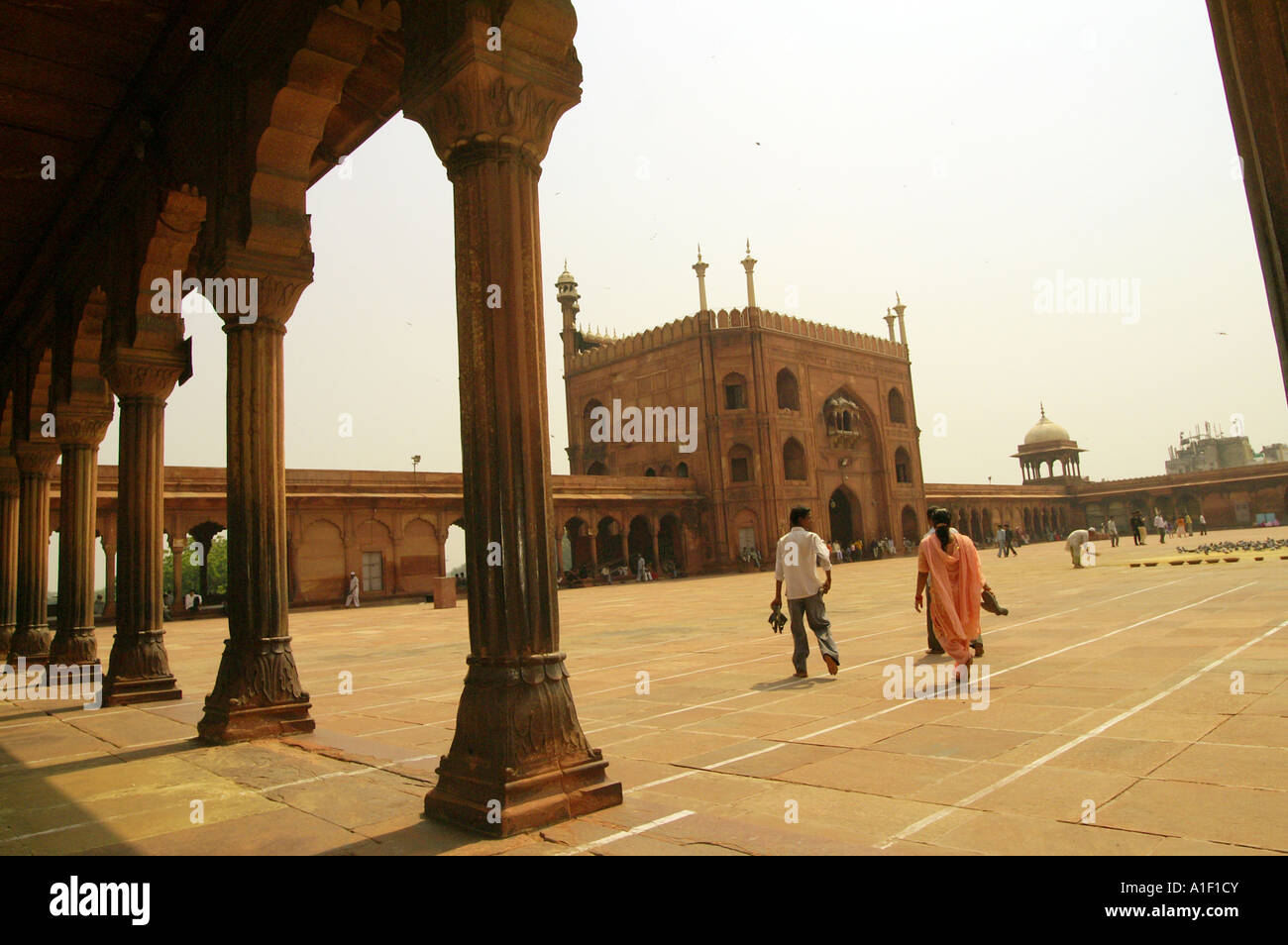 Couple walking in Jama Masjid muslim mosque, New Delhi, India Stock ...