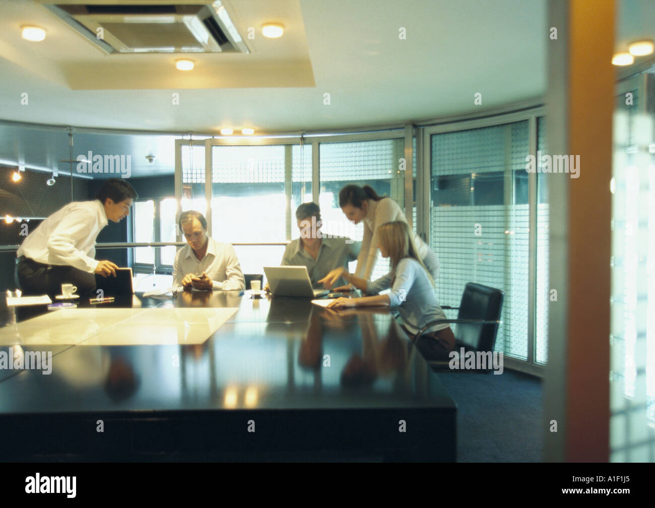 Businesspeople working in conference room Stock Photo - Alamy