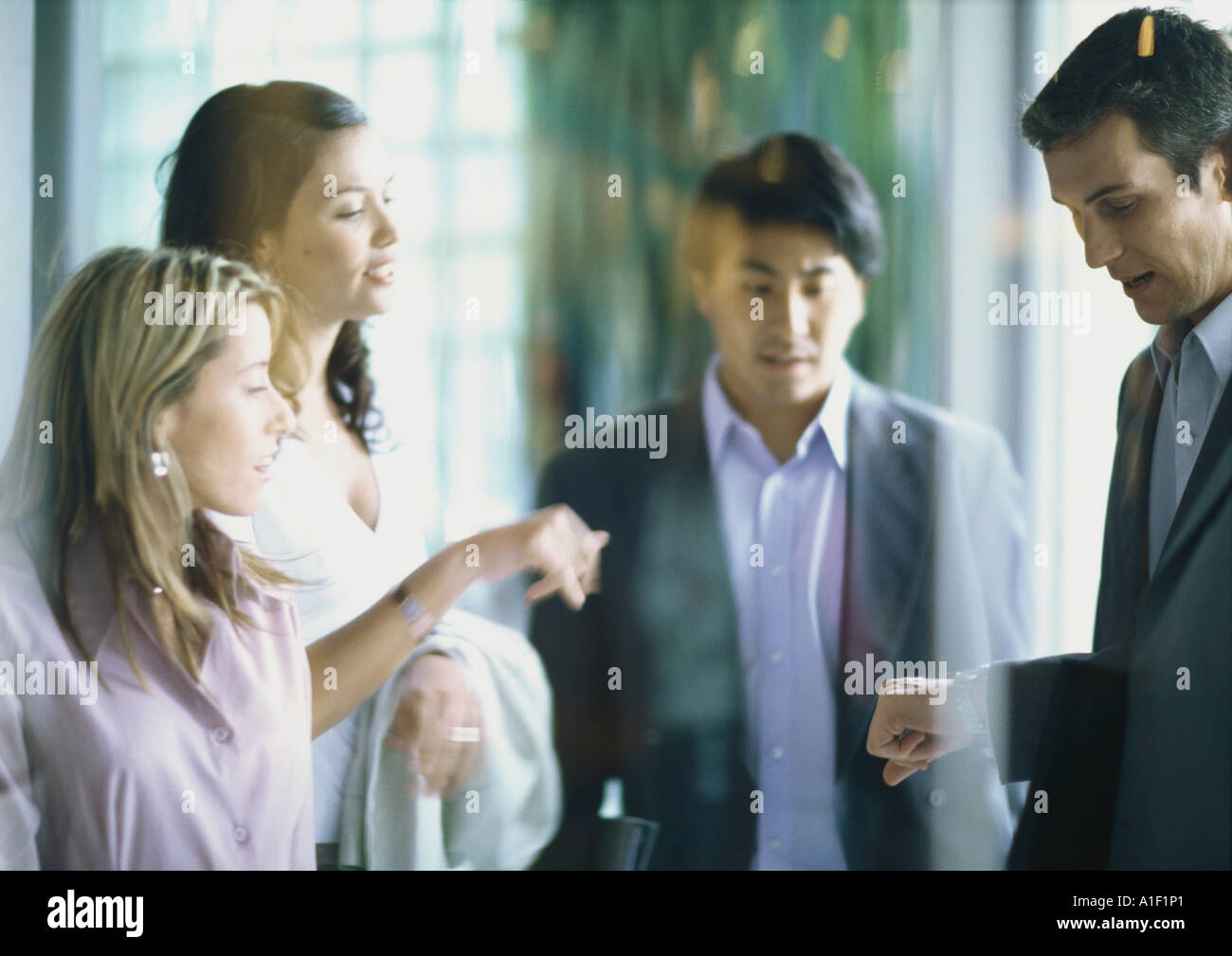 Group of businesspeople checking time Stock Photo - Alamy
