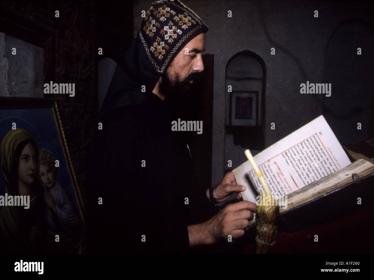 Egyptian Coptic monk reading the Holy Bible, Deir al-Muharraq, Egypt ...