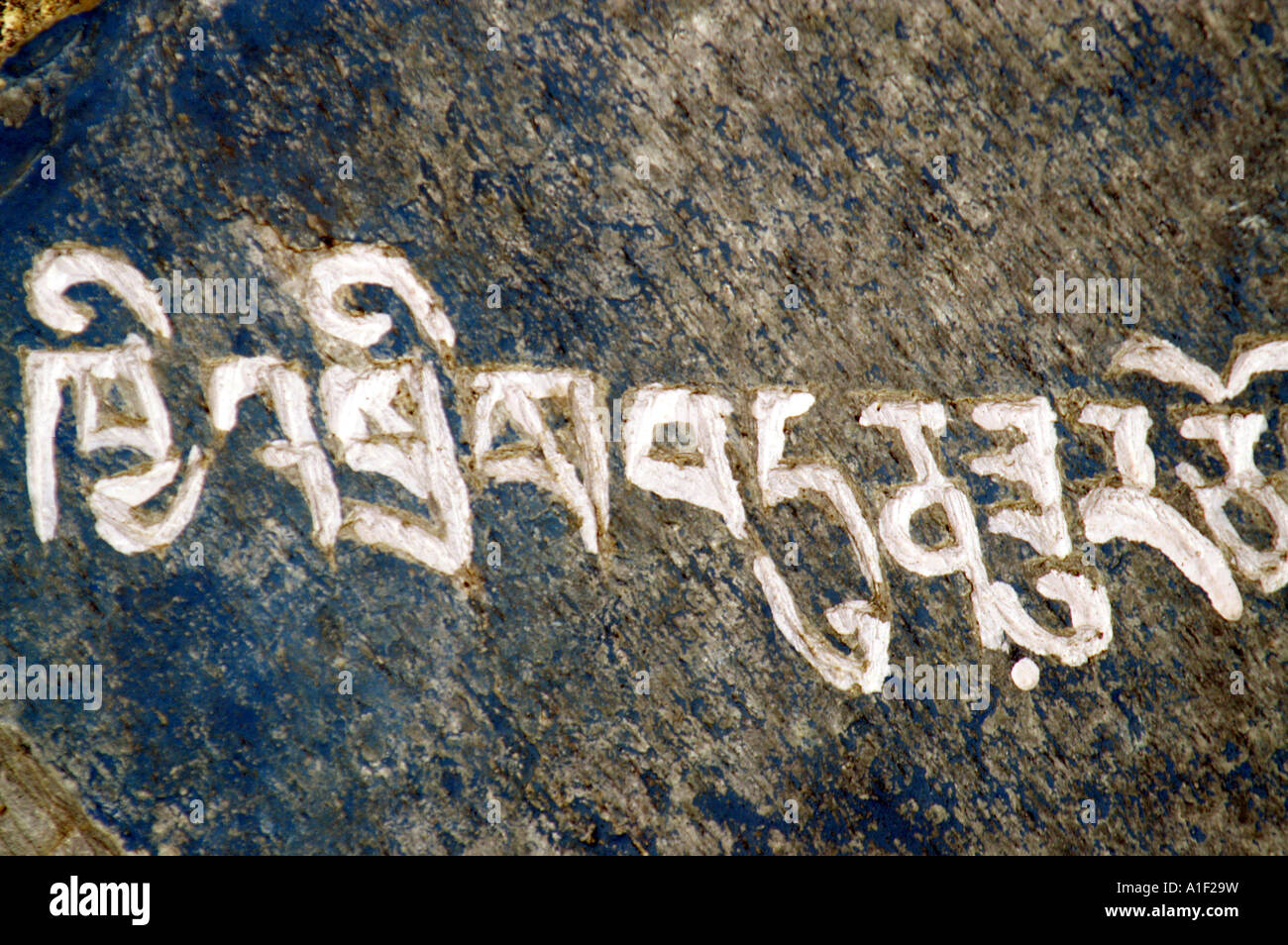 Mani white sign on Mani stone, McLeod Ganj, India Stock Photo - Alamy