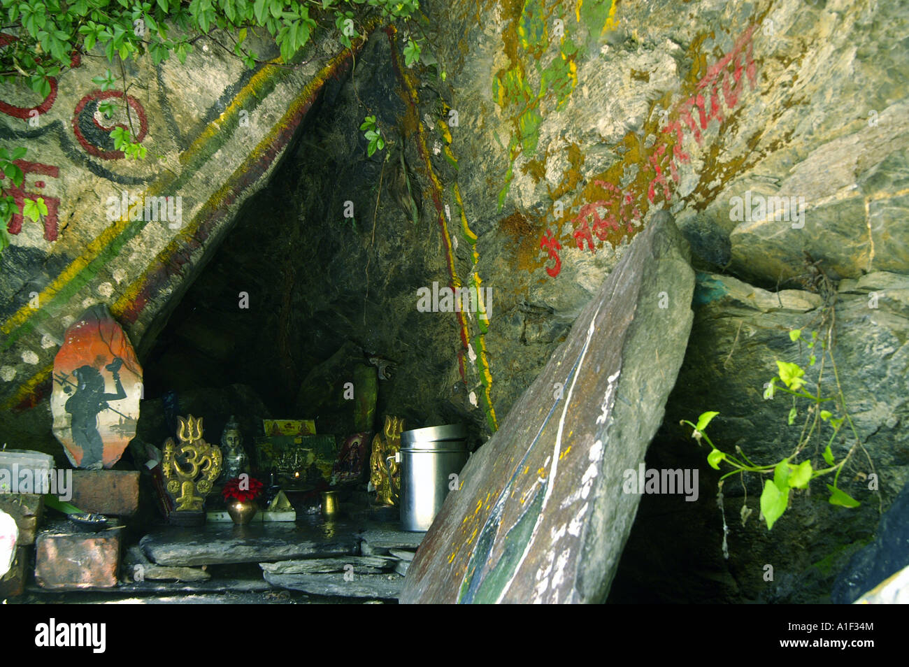 Hinduistic mini temple shrine in rock niche Stock Photo - Alamy