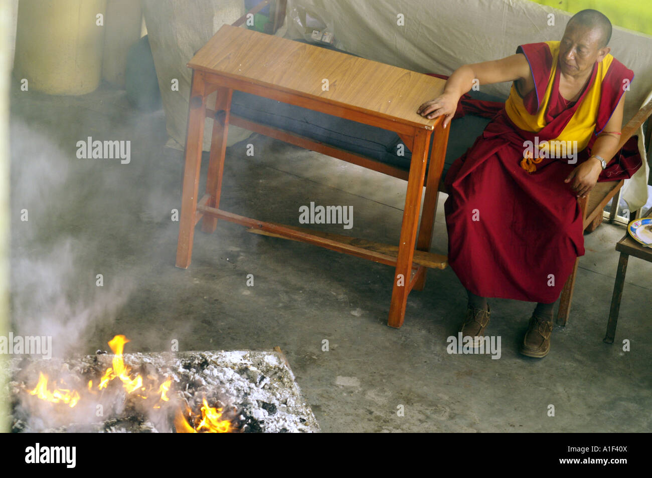 Tibetan buddhist monk preforming fire puja ritual in Namgyal monastery ...