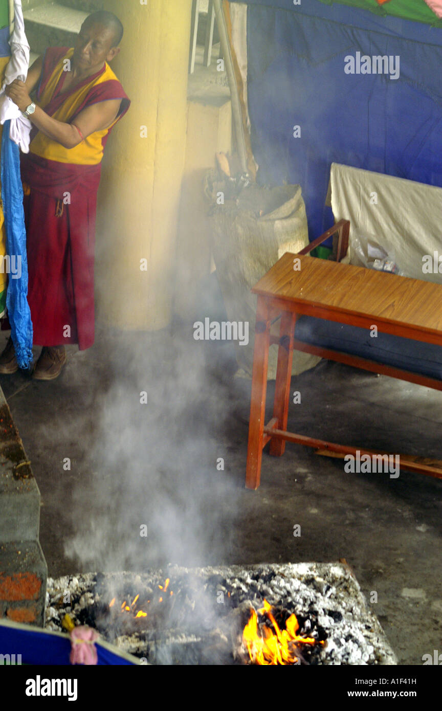 Tibetan buddhist monk preforming fire puja ritual in Namgyal monastery ...
