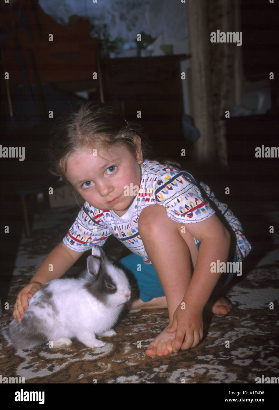 A girl with a rabbit Stock Photo - Alamy