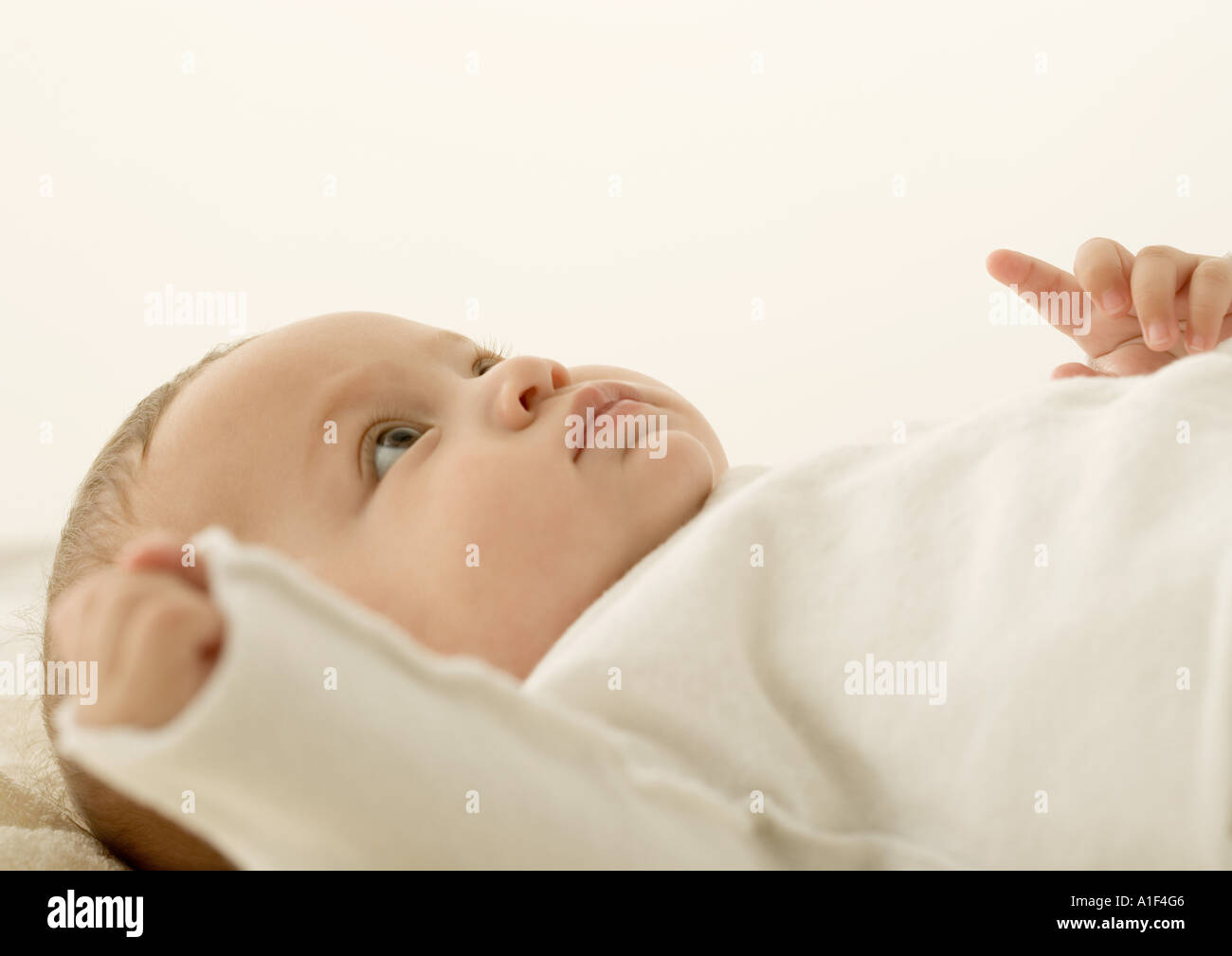 Baby lying on back Stock Photo - Alamy