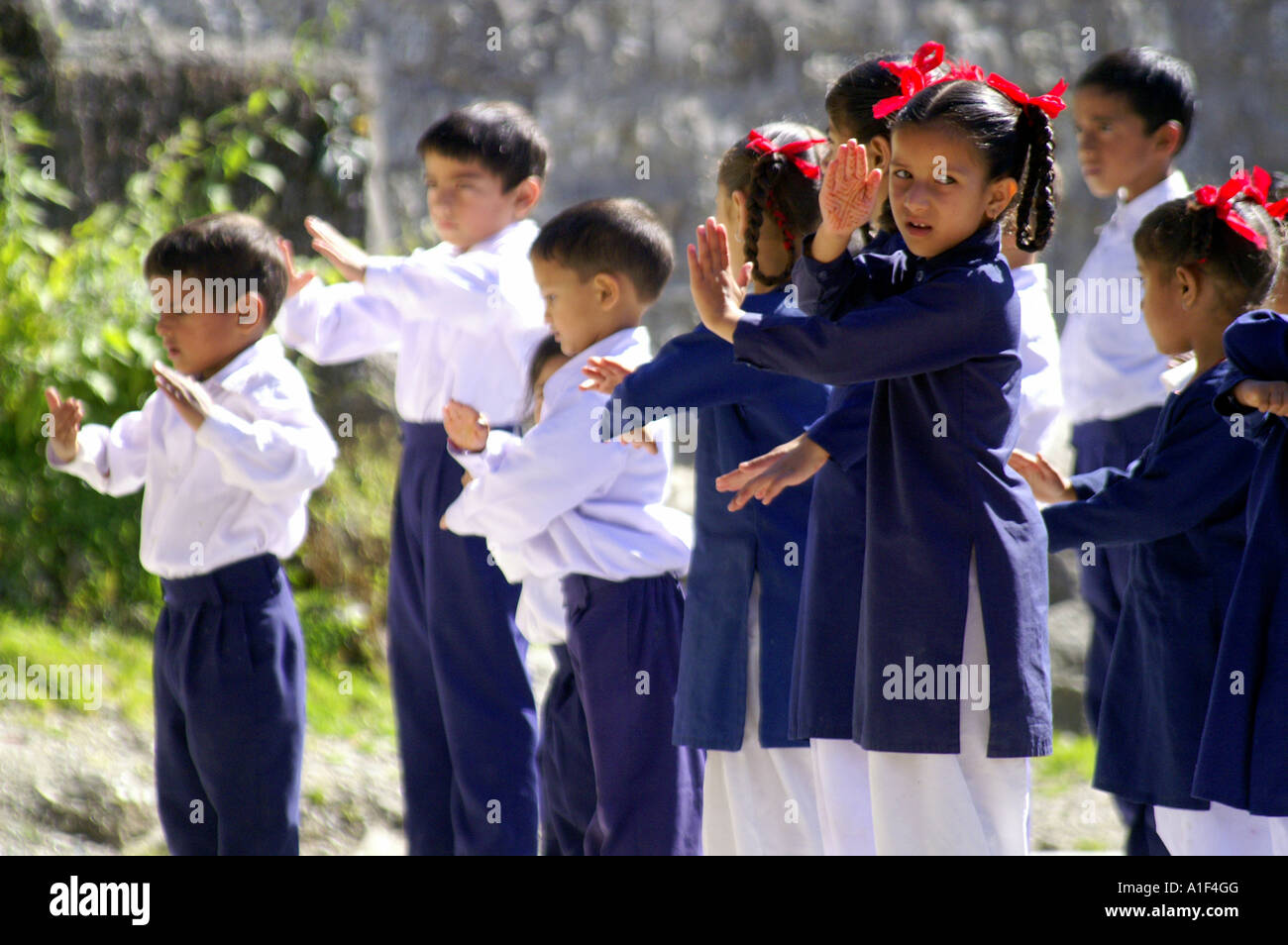 Pupils of indian primary school exercising outdoors Stock Photo - Alamy