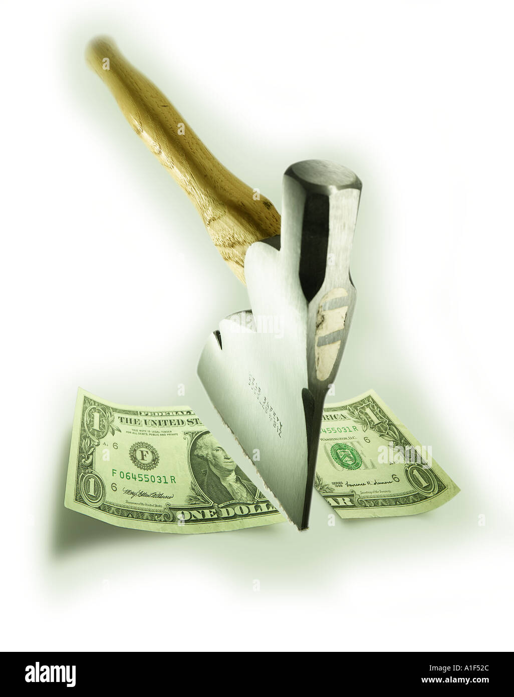 Ax splitting a one dollar bill Stock Photo - Alamy