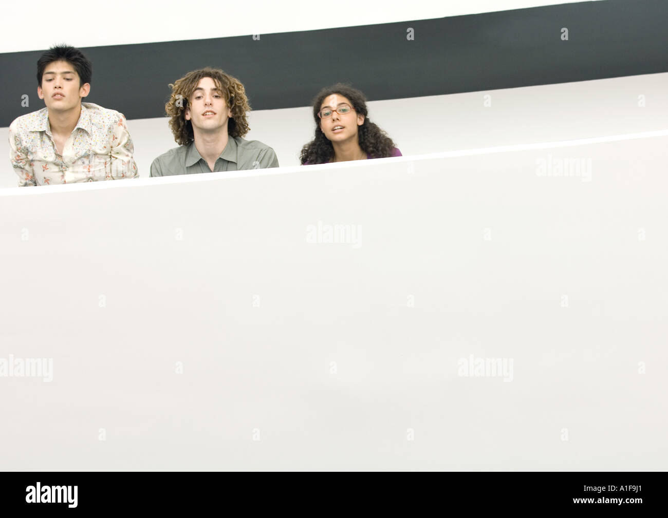 Woman looking down from balcony hi-res stock photography and images - Alamy
