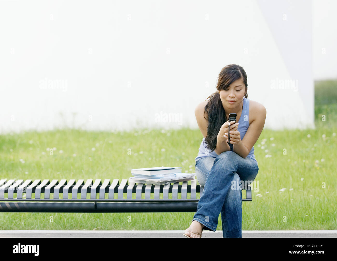 Asian Girl Sitting On Bench High Resolution Stock Photography and ...