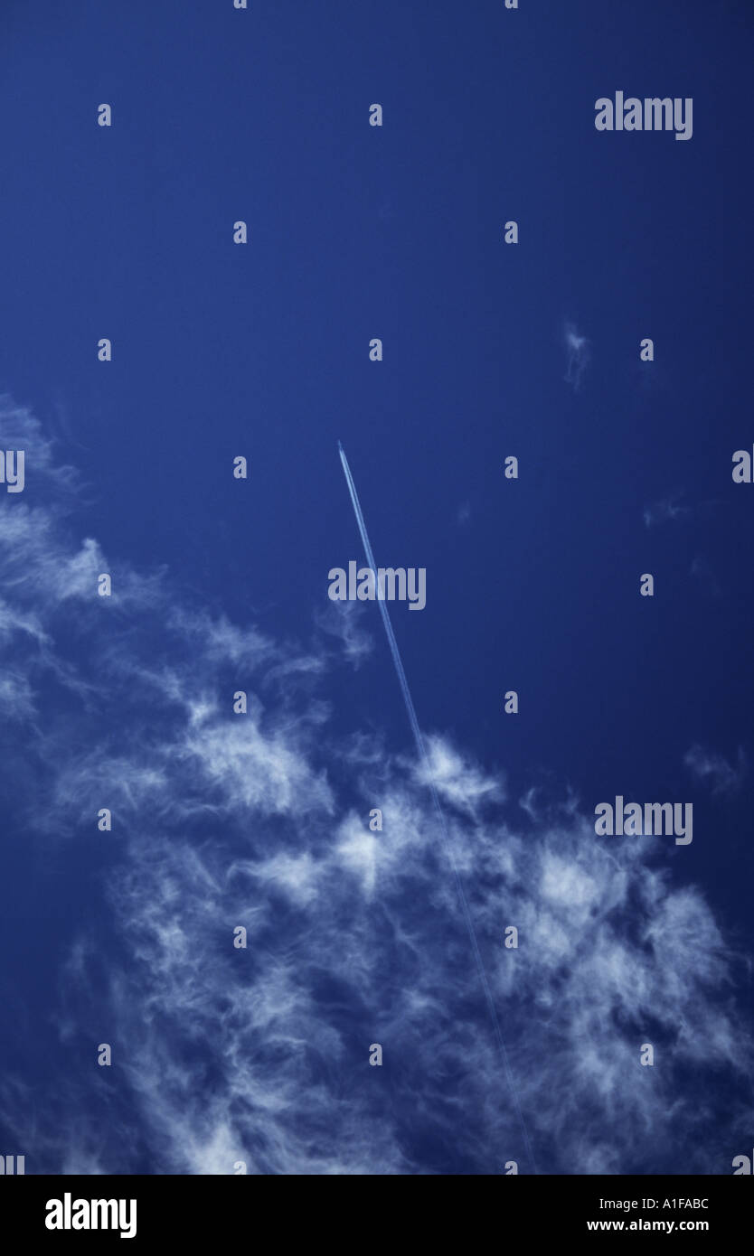 Cloud formation with airplane contrail Stock Photo - Alamy