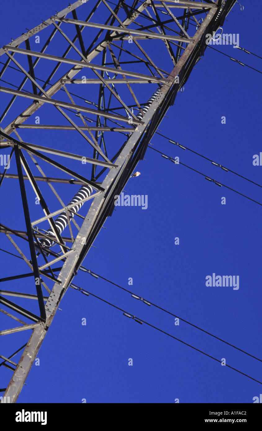 Electricity pylon viewed from below with deep blue sky Stock Photo - Alamy