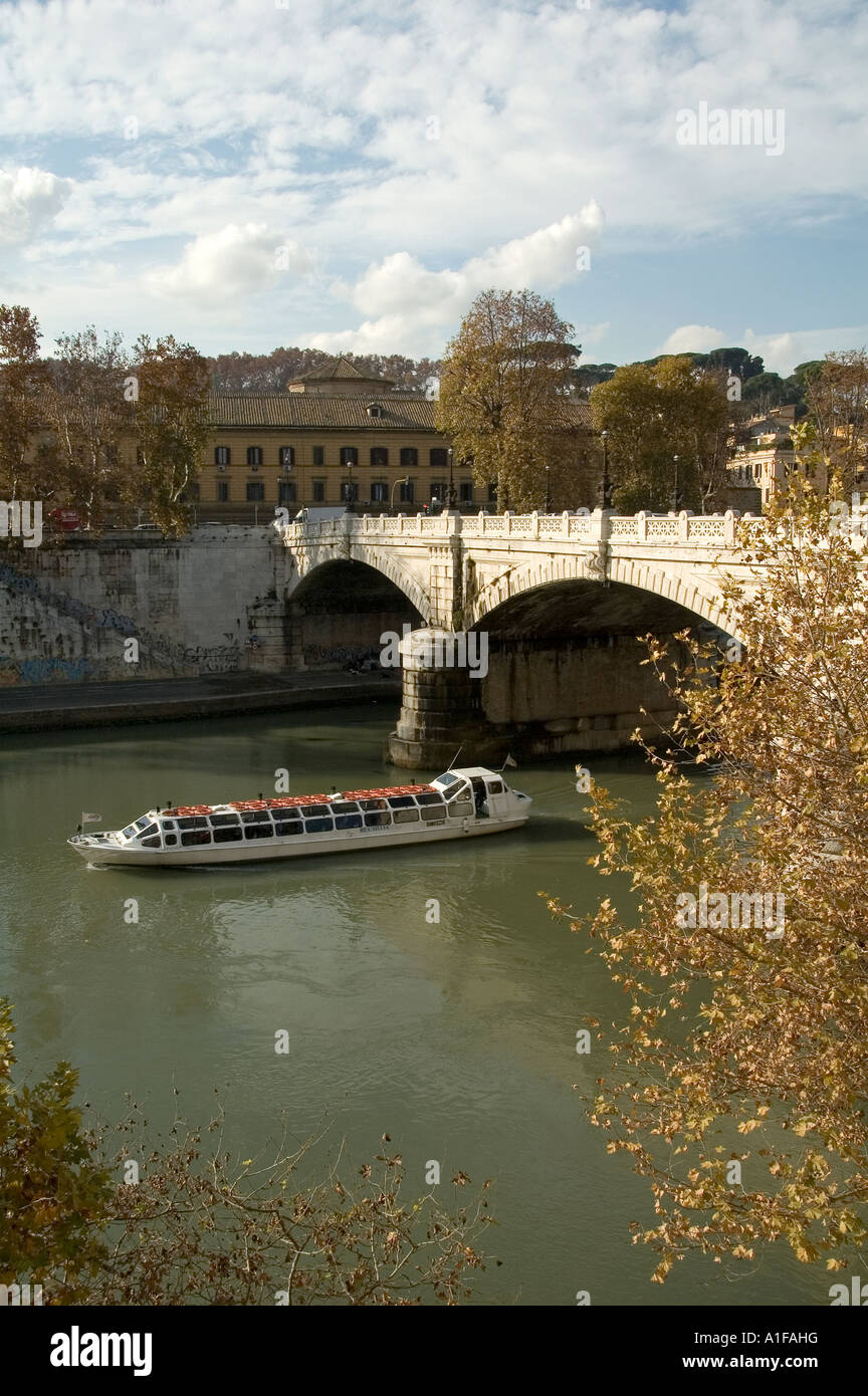 Tour boat passing through Ponte Sisto bridge over Tiber river with ...