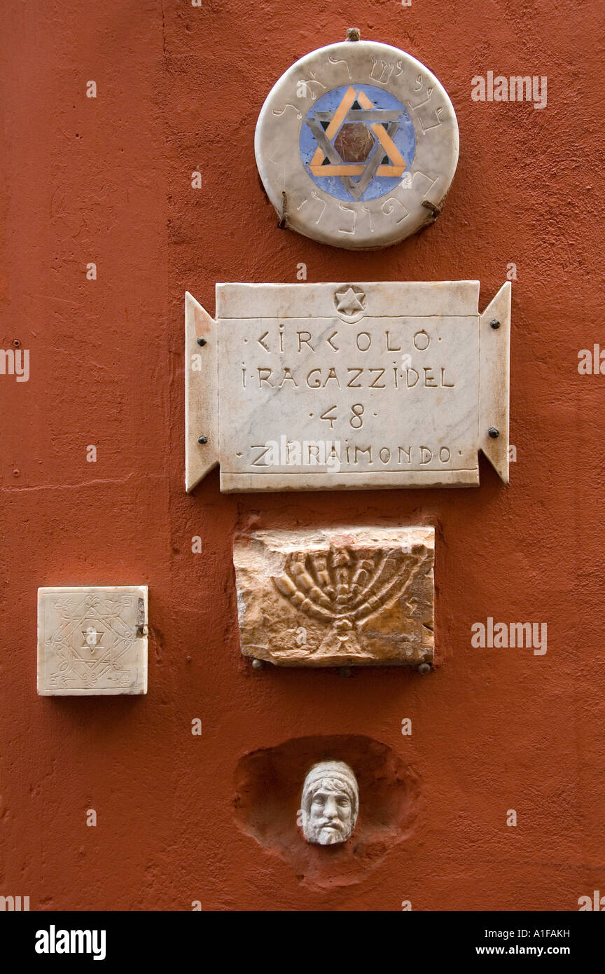 Fragments of Jewish relics mounted on a wall in Via della Reginella ...
