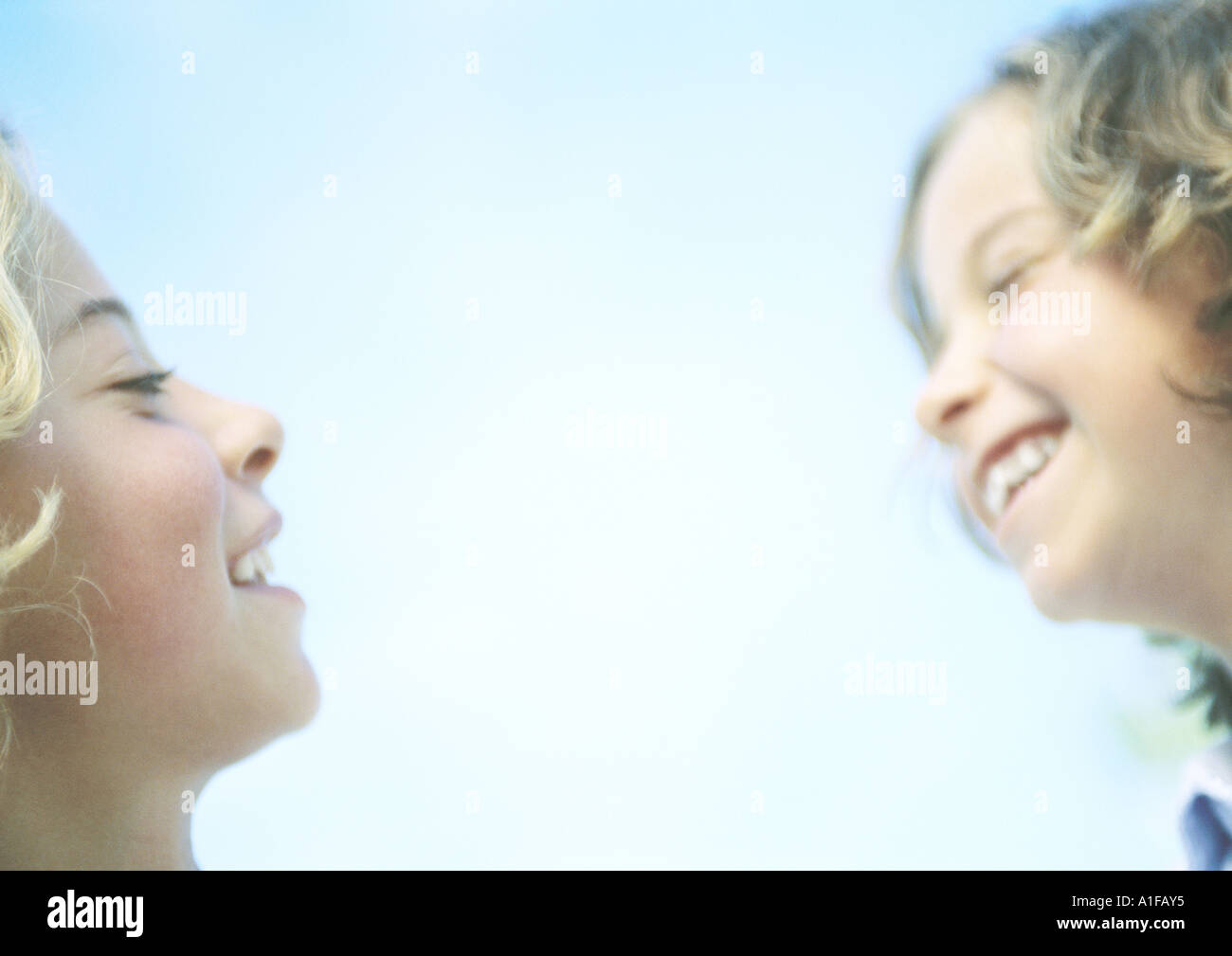 Two girls laughing Stock Photo - Alamy