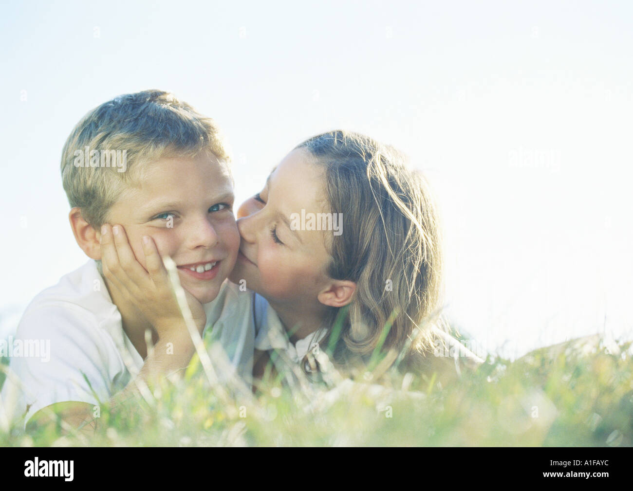 Couple lying down on kiss hi-res stock photography and images - Alamy
