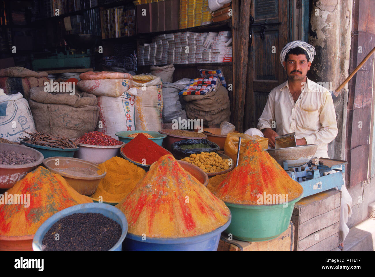 A man selling spices in his shop at Saidu Sharif Swat Pakistan Asia G ...