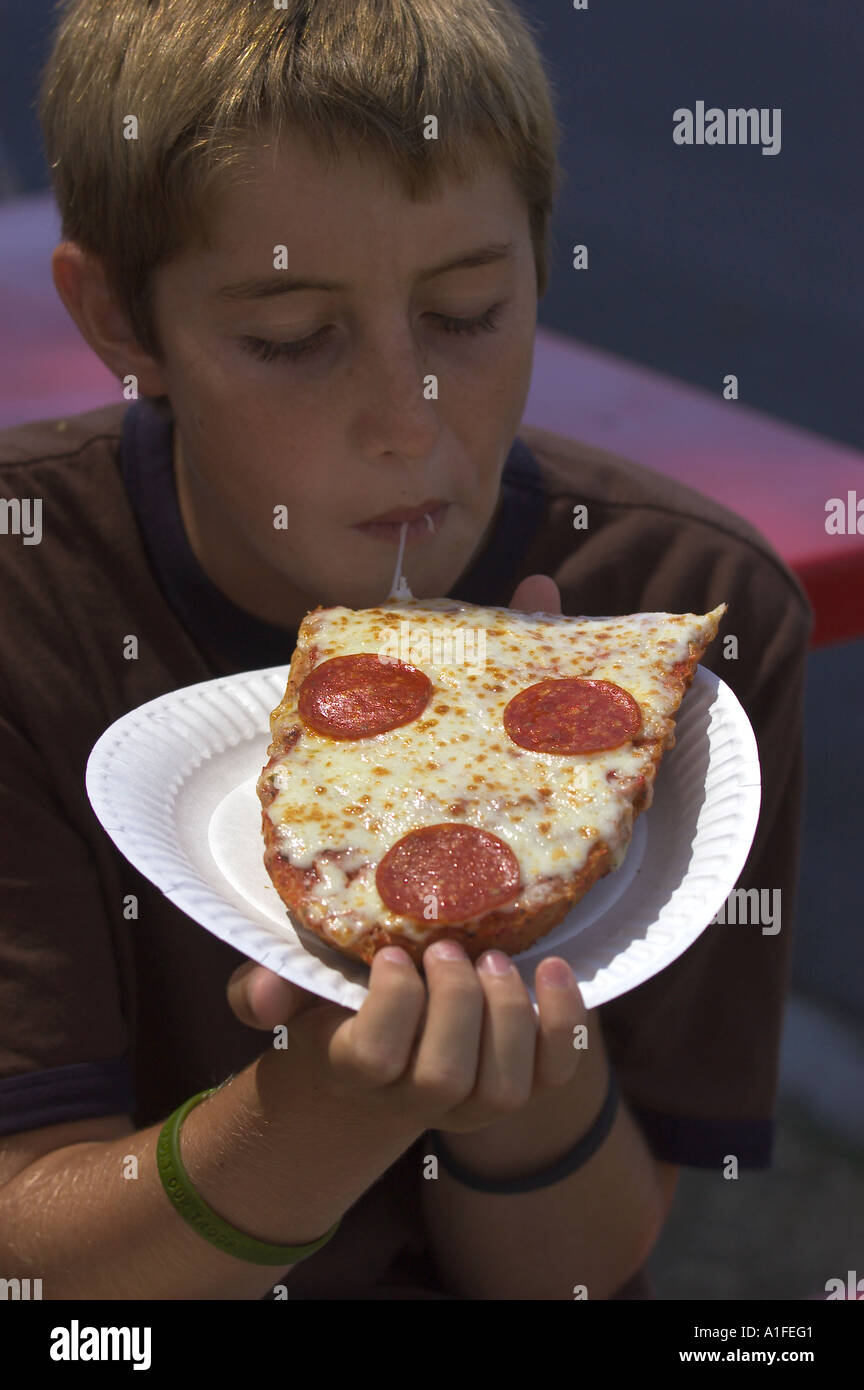 boy eating pizza Stock Photo - Alamy