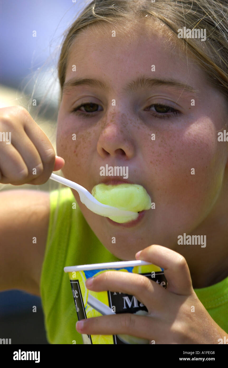 girl eating frozen lemonade Stock Photo - Alamy