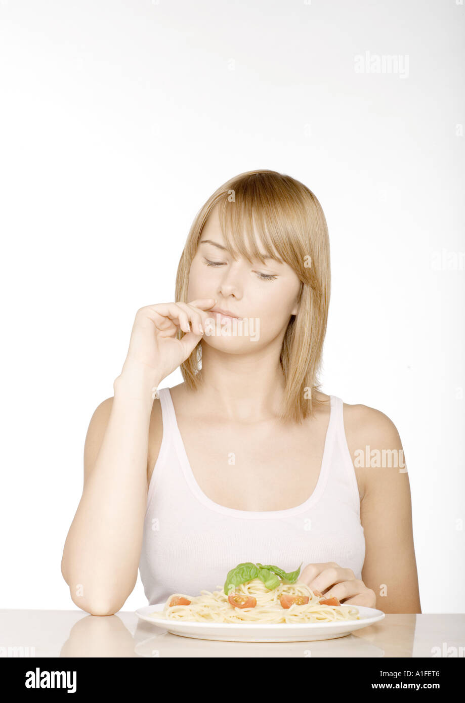 Woman looking down at plate of pasta Stock Photo - Alamy Woman looking down at plate of pasta Stock Photo - Alamy