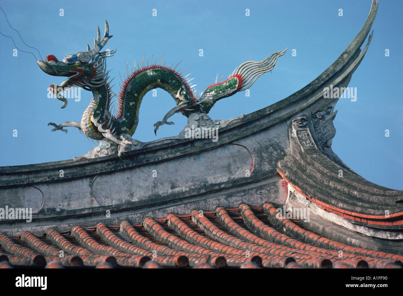 Dragon statue on a temple roof in Taiwan Asia P Van Riel Stock Photo ...