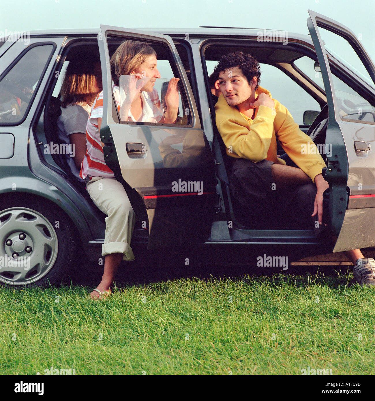 Friends in a car Stock Photo - Alamy