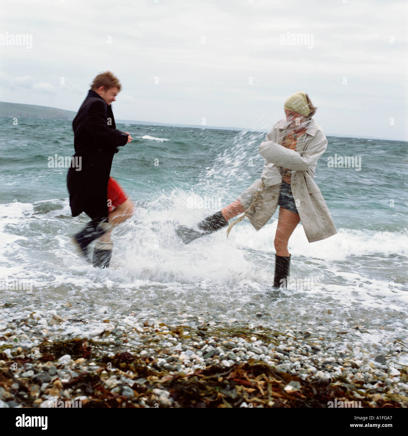 Playing on the beach Stock Photo - Alamy