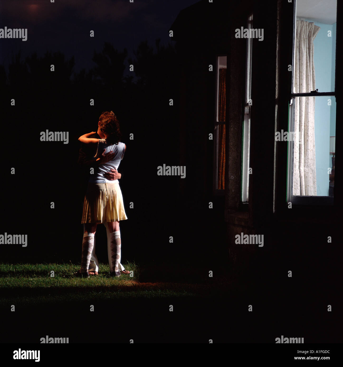 Man outside house night hi-res stock photography and images - Alamy