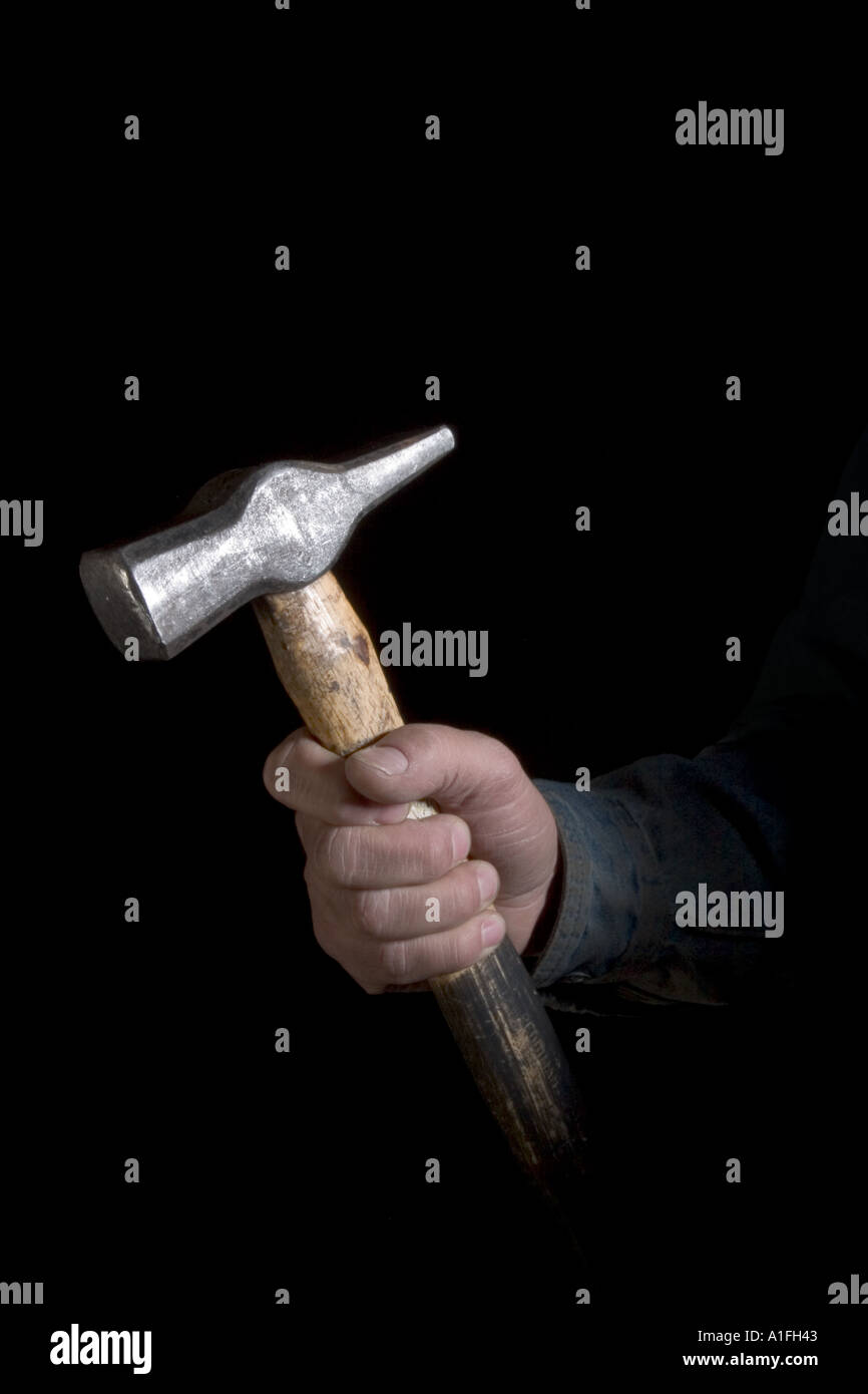 Hand And Hammer Stock Photo - Alamy