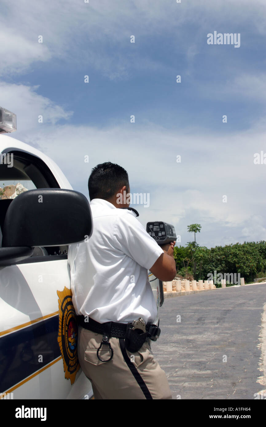 Police officer checking speed with radar gun hi-res stock photography ...
