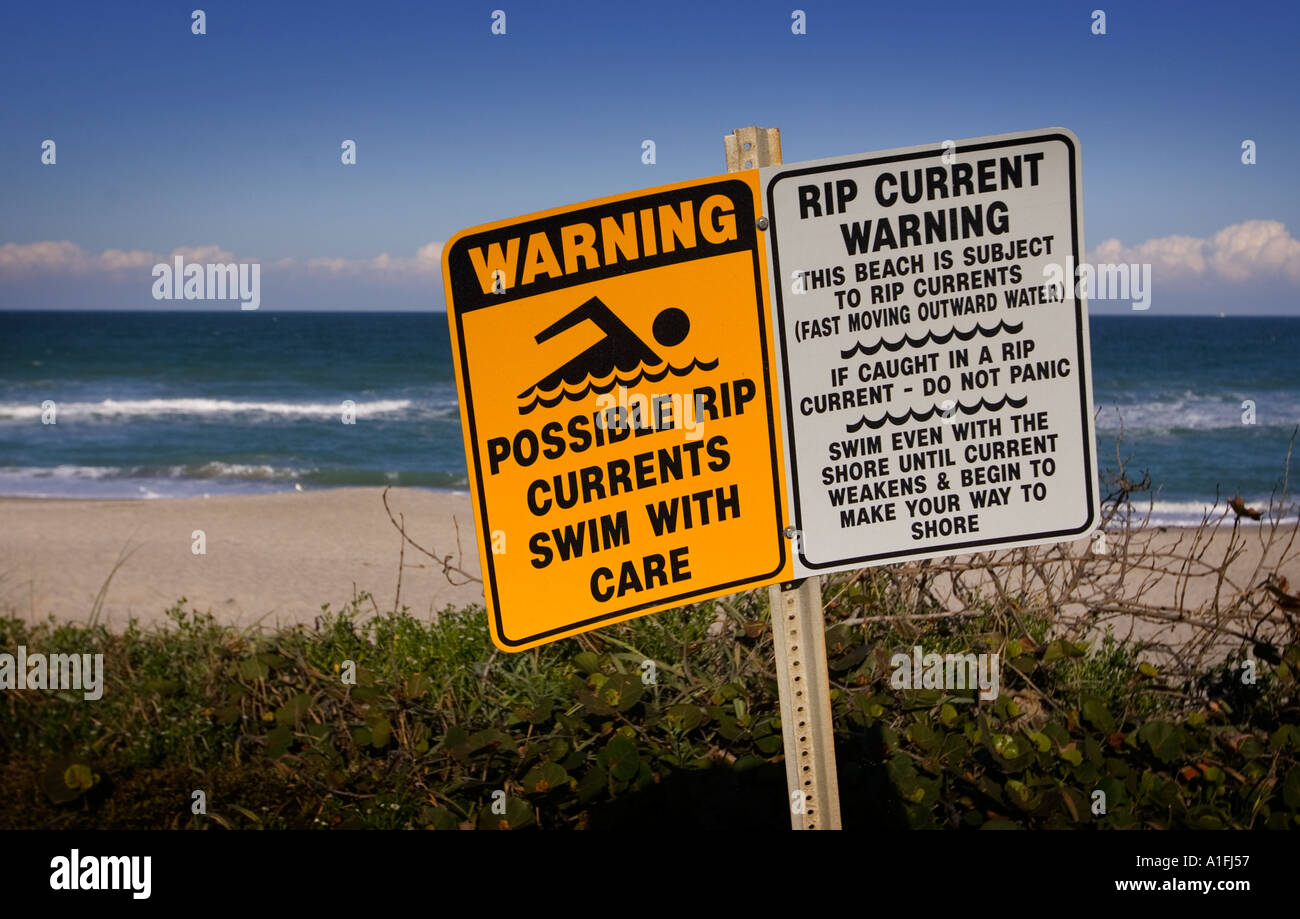 Signs warning of dangers due to currents near a beach Stock Photo - Alamy