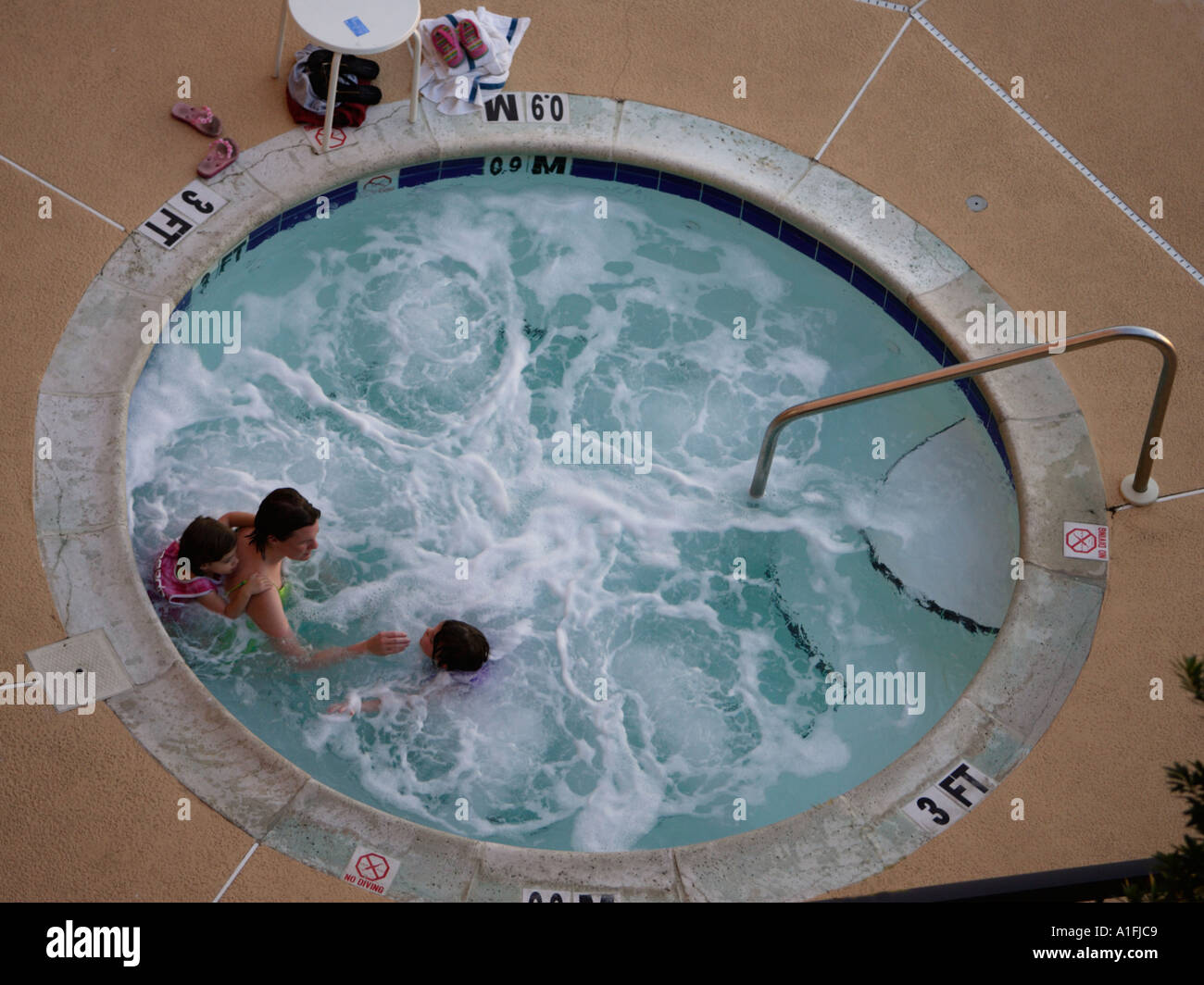 Group of people in an outdoor spa Stock Photo - Alamy
