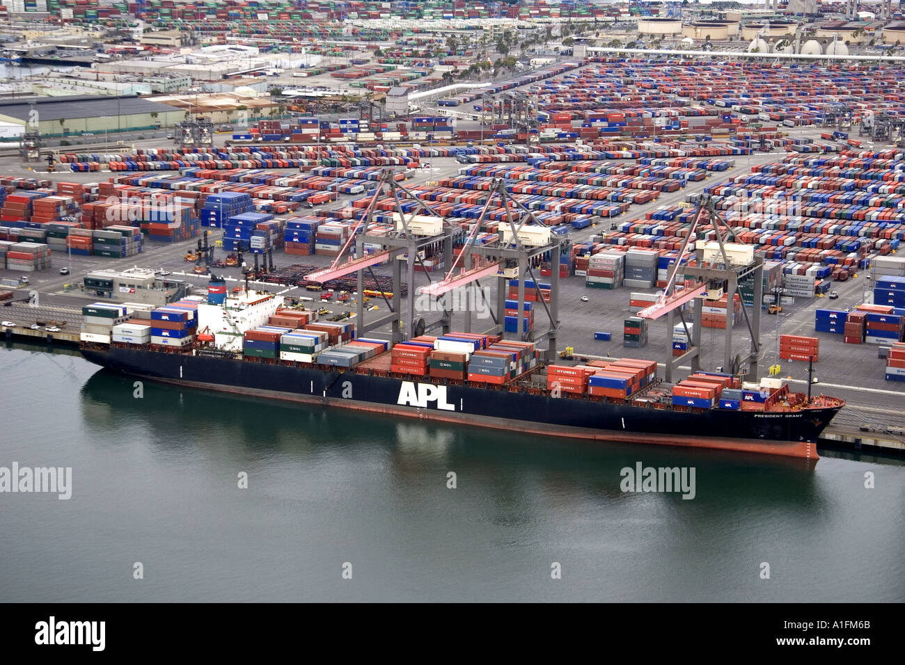 Containers being unloaded from a ship at the Port of Long Beach in Los ...