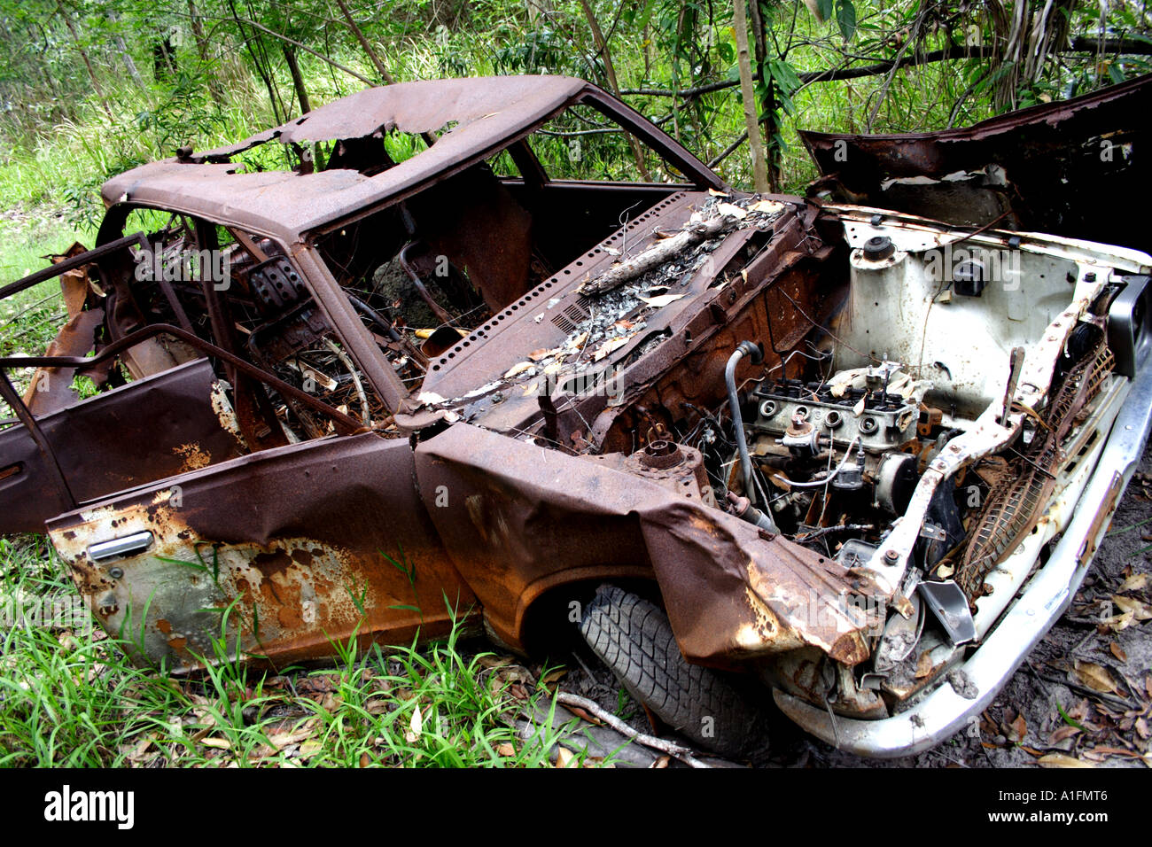 BURNT OUT SMASHED MOTOR VEHICLE DUMPED IN BUSH Stock Photo - Alamy