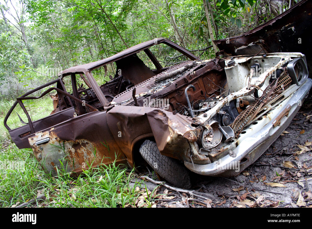 BURNT OUT SMASHED MOTOR VEHICLE DUMPED IN BUSH Stock Photo - Alamy