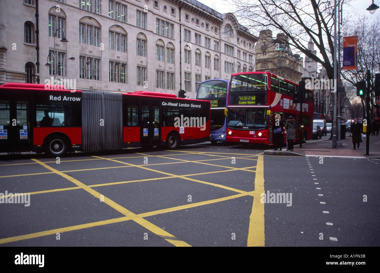 Articulated single decker London bus taxi traffic central London ...