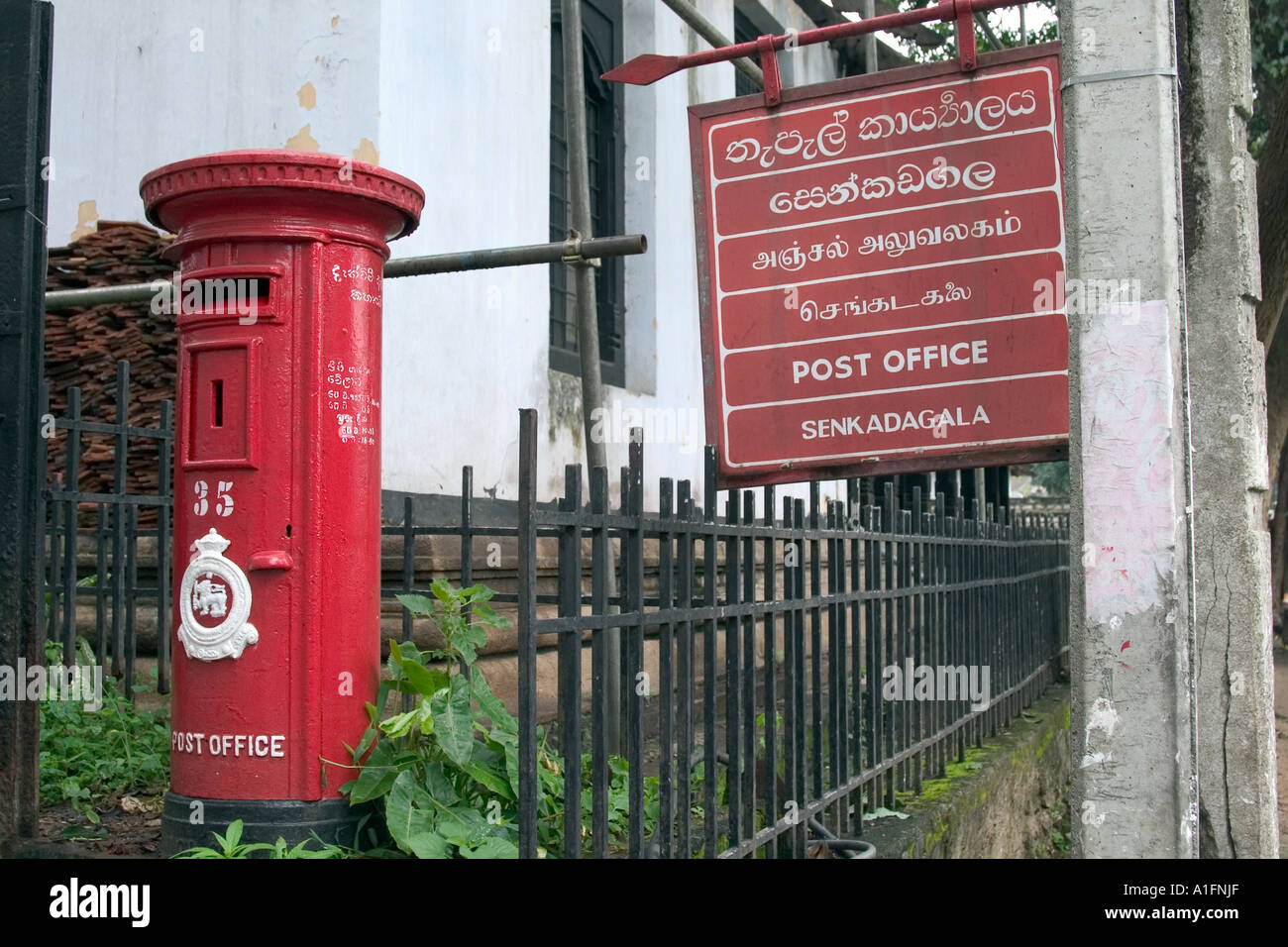 Red post box and post office sign. Kandy, Sri Lanka Stock Photo - Alamy