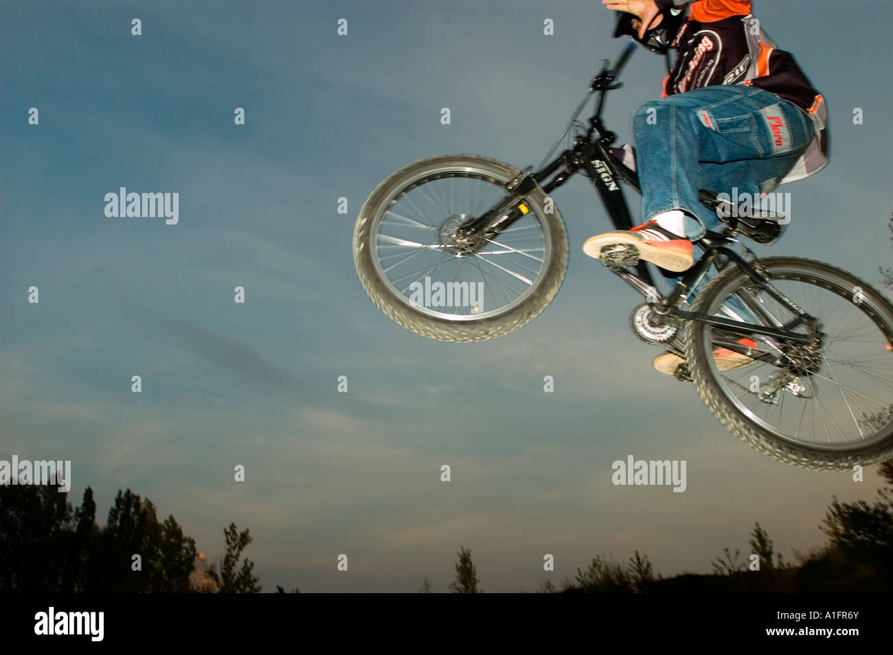 Man on bike jumping from hop Stock Photo - Alamy