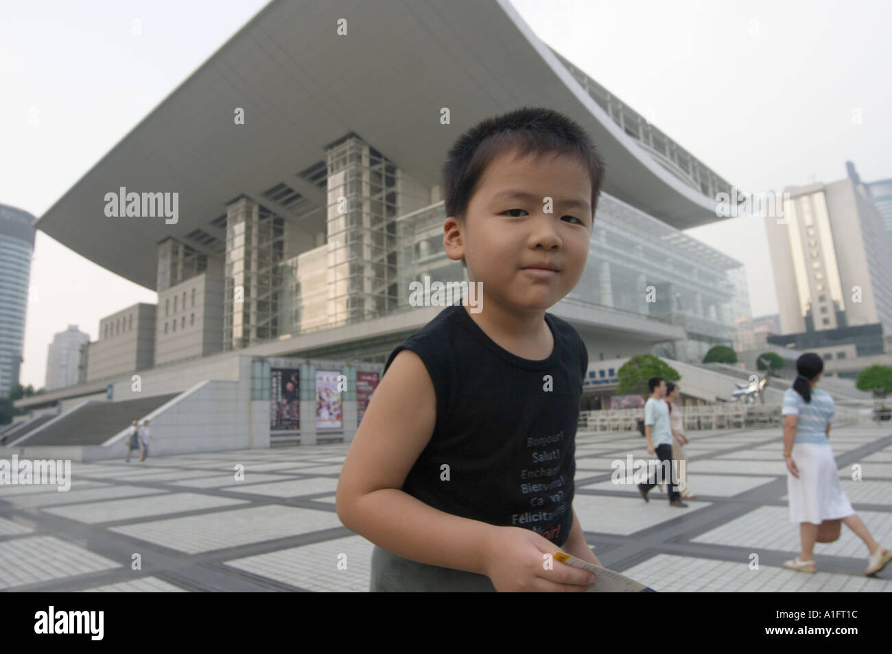 chinese boy outside shanghai grand theatre on peoples square in ...