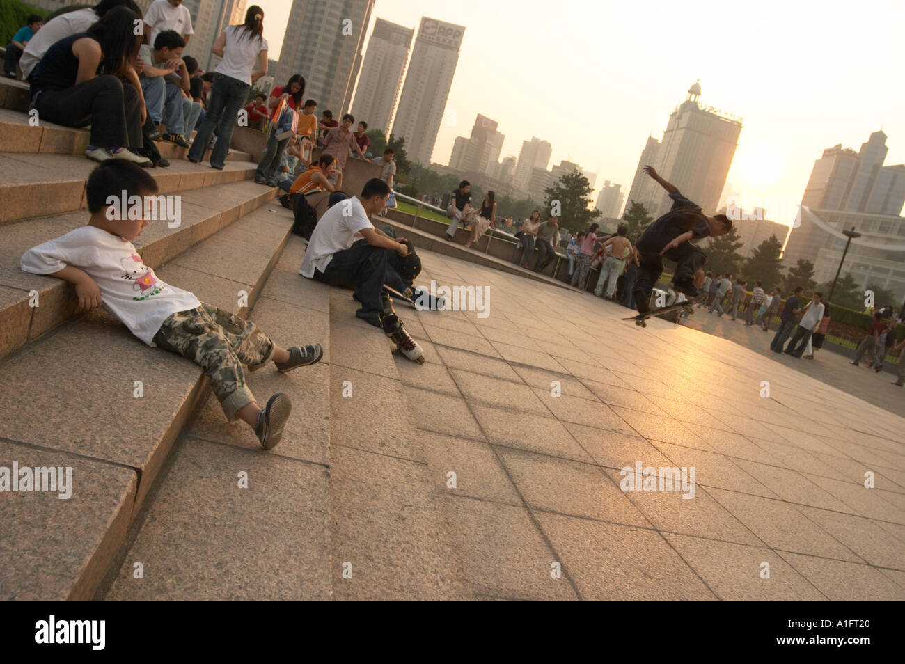 teens skateboarding in peoples square shanghai china Stock Photo - Alamy