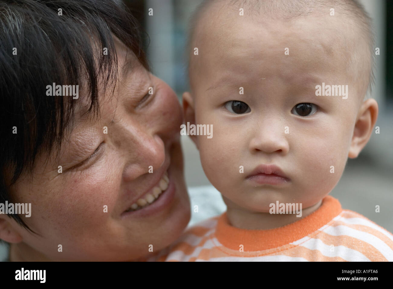 mother and baby in old town shanghai china Stock Photo - Alamy