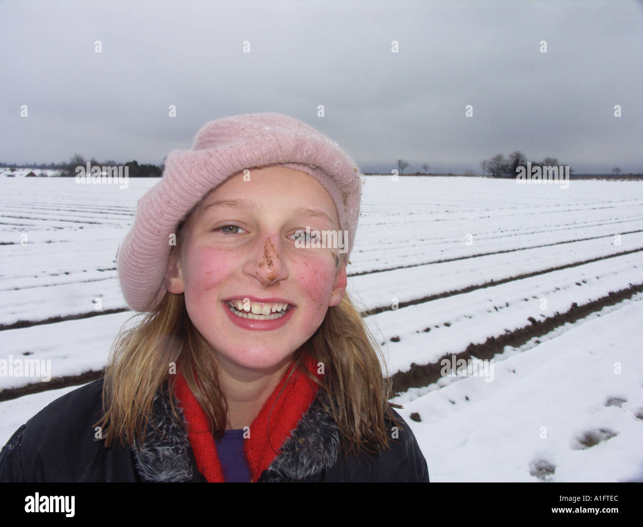 Young girl in pink beret with snow background Stock Photo - Alamy