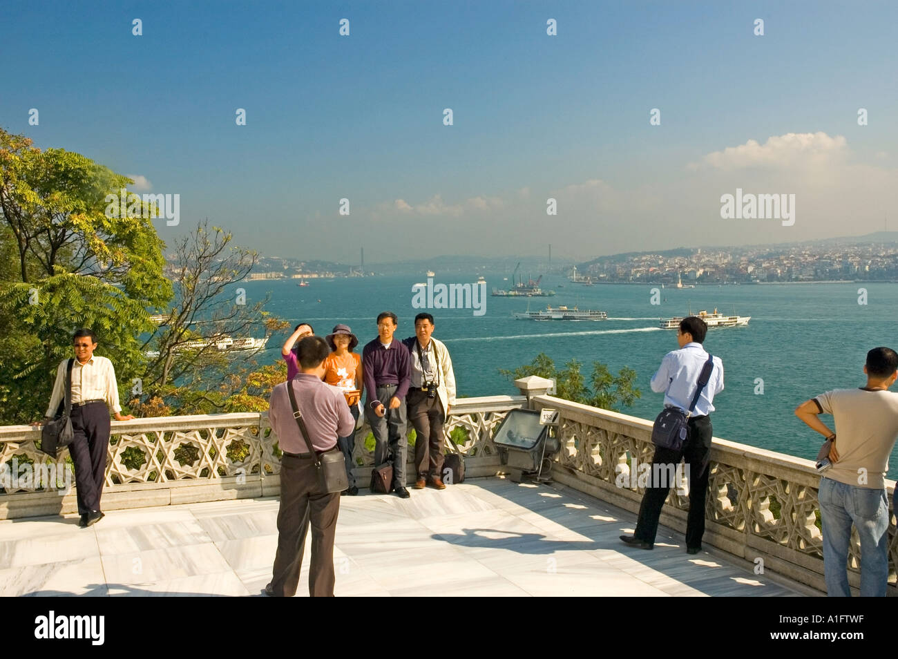 Tourists taking photos on the Cafe Terrace, with Bosphorus in ...
