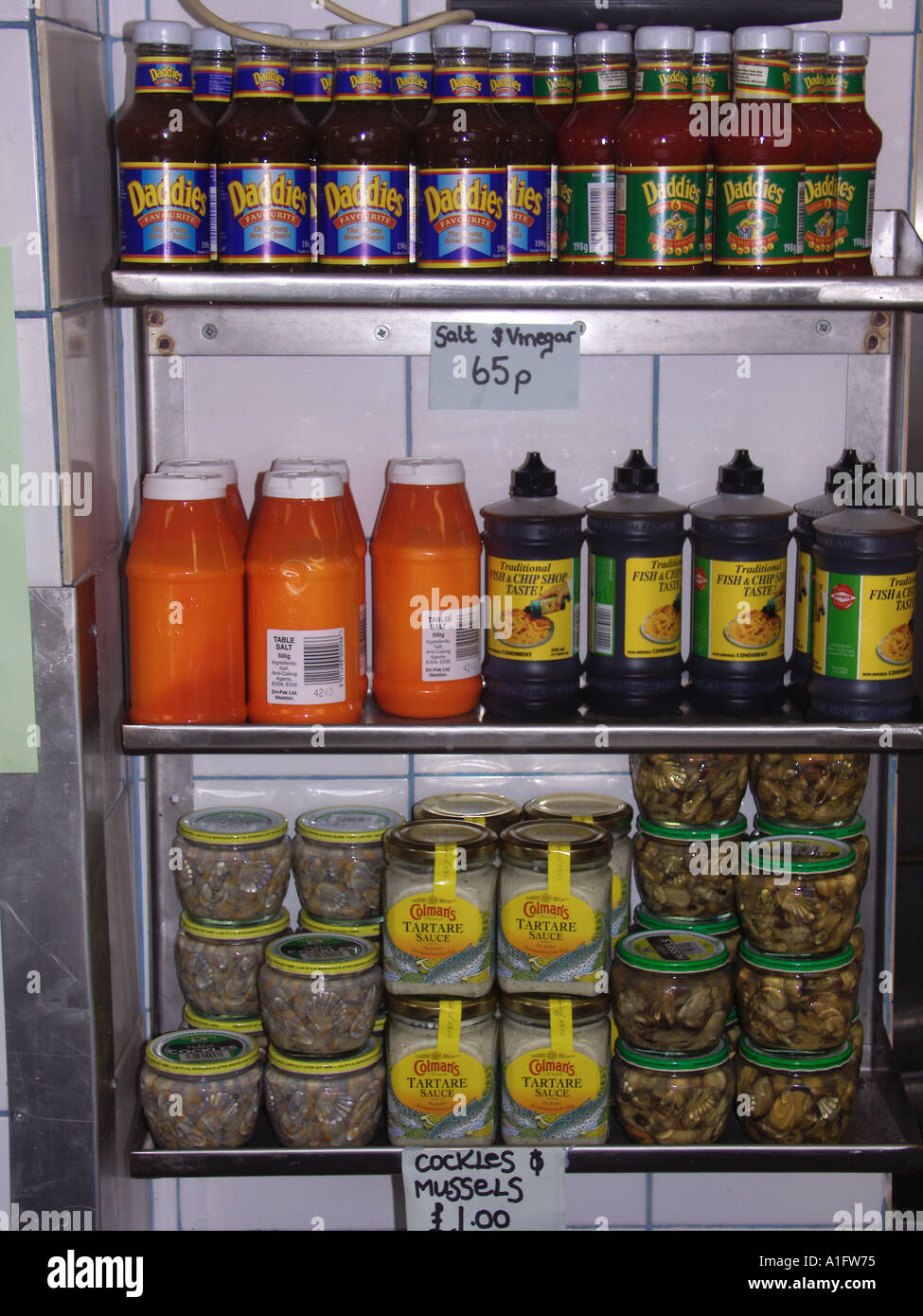 Fish and chip shop sauces and pickles in jars and containers Stock ...