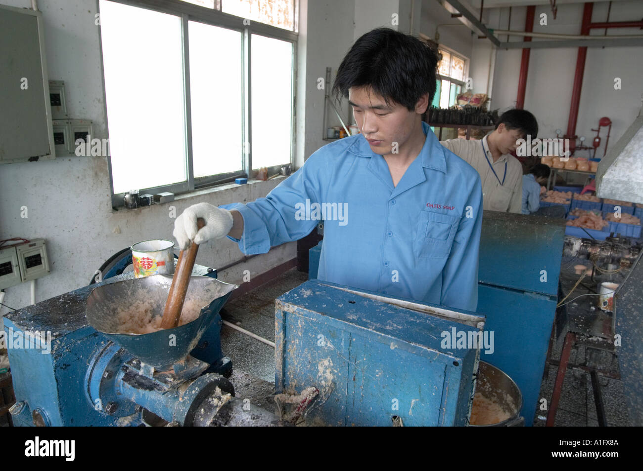 Chinese migrant workers at factories hi-res stock photography and ...