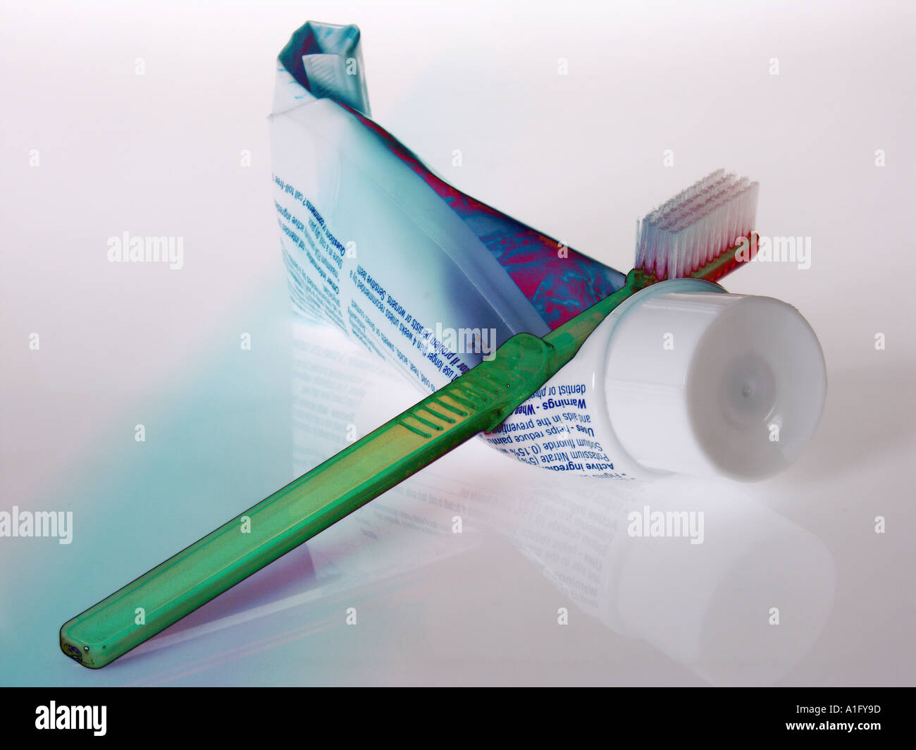 Toothpaste tube with toothbrush Stock Photo - Alamy