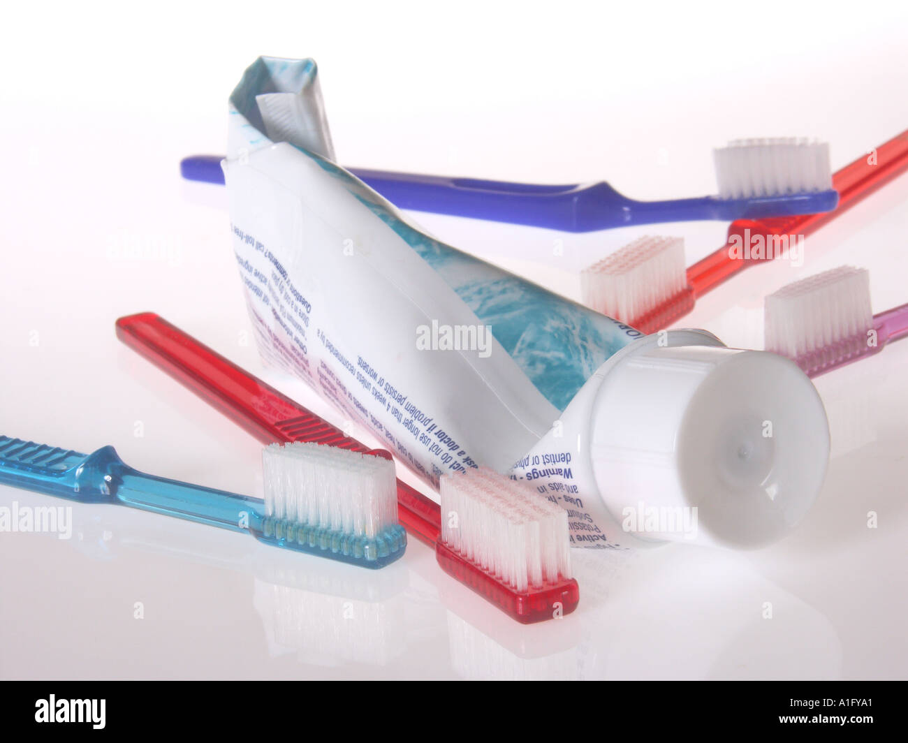 Toothpaste tube with toothbrushes Stock Photo - Alamy
