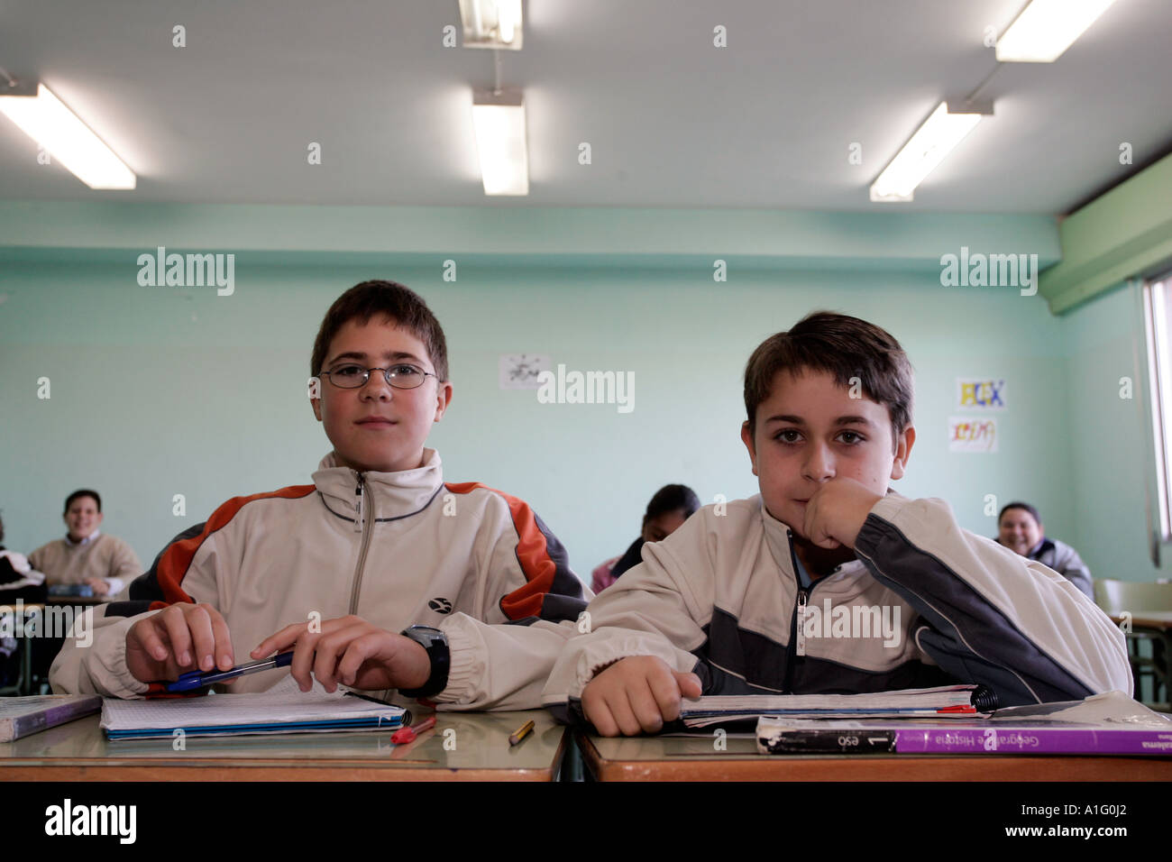 Schoolboys doing their task in classroom Stock Photo - Alamy
