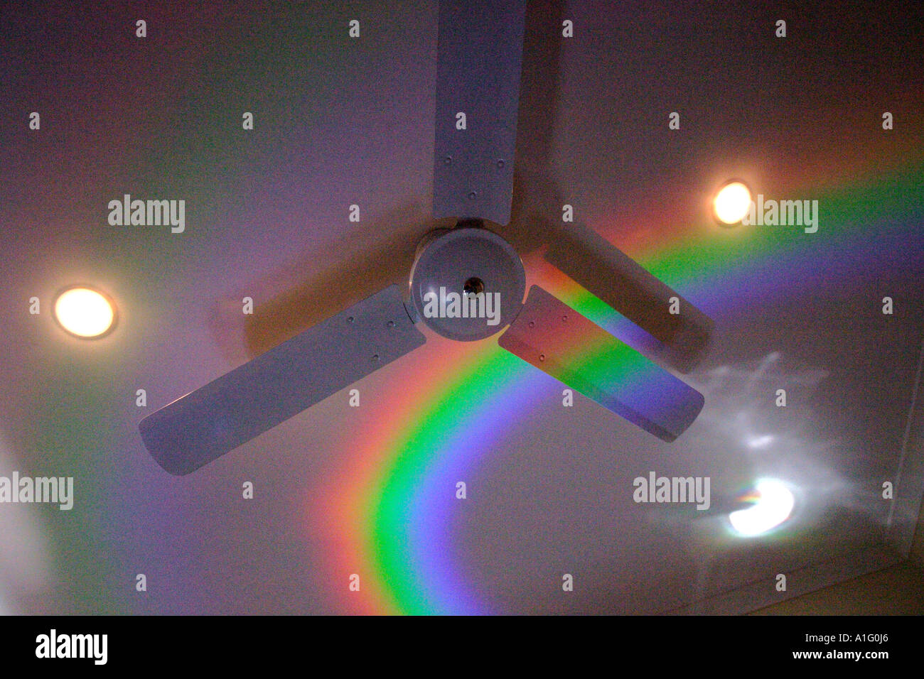 rainbow reflection on a ceiling fan Stock Photo - Alamy
